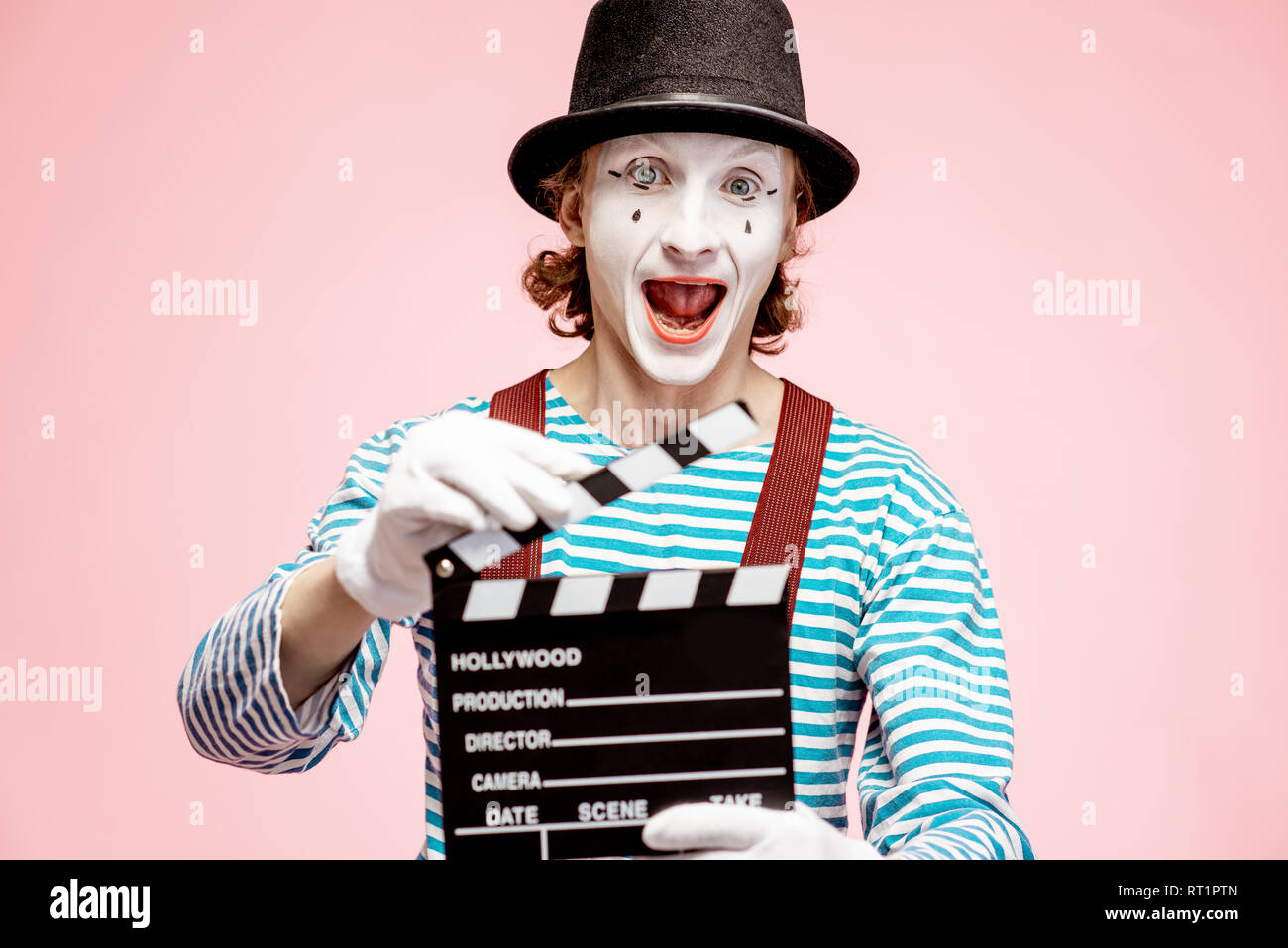 Portrait of an actor as a pantomime with cinematography clapperboard on ...