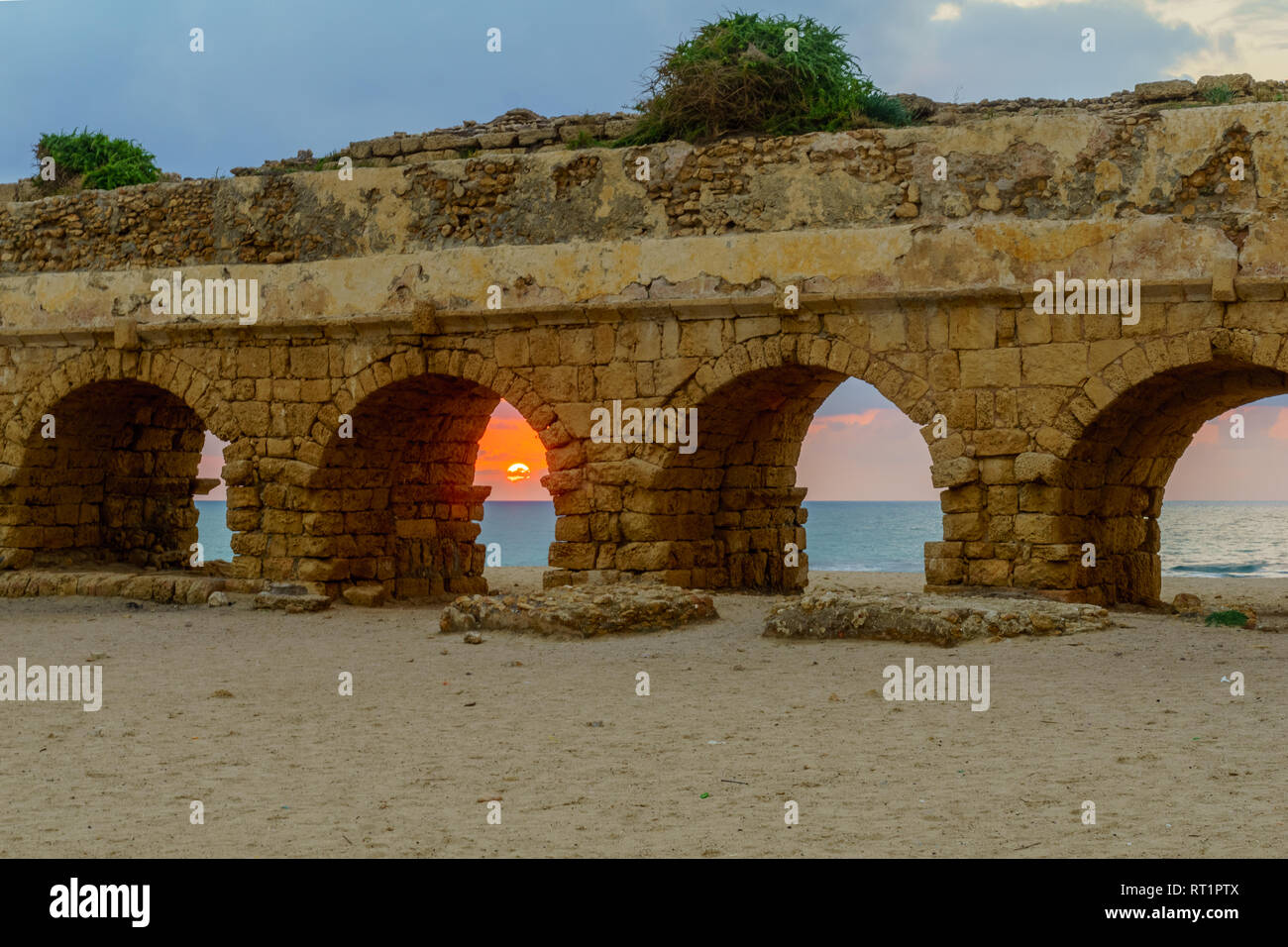 Sunset view of the beach and the Roman Aqueduct in Caesarea, Northern ...