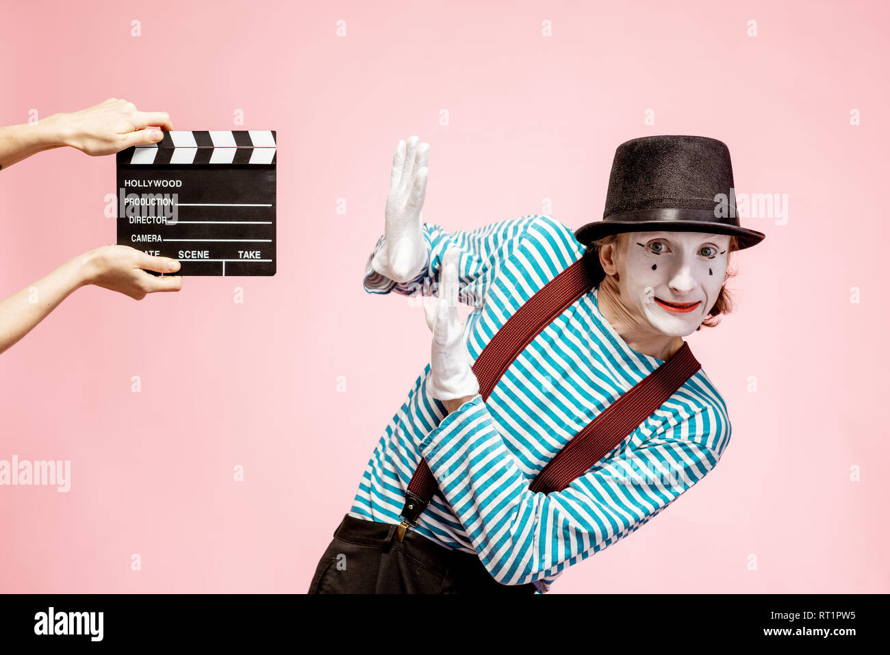 Portrait of an actor as a pantomime with cinematography clapperboard on ...