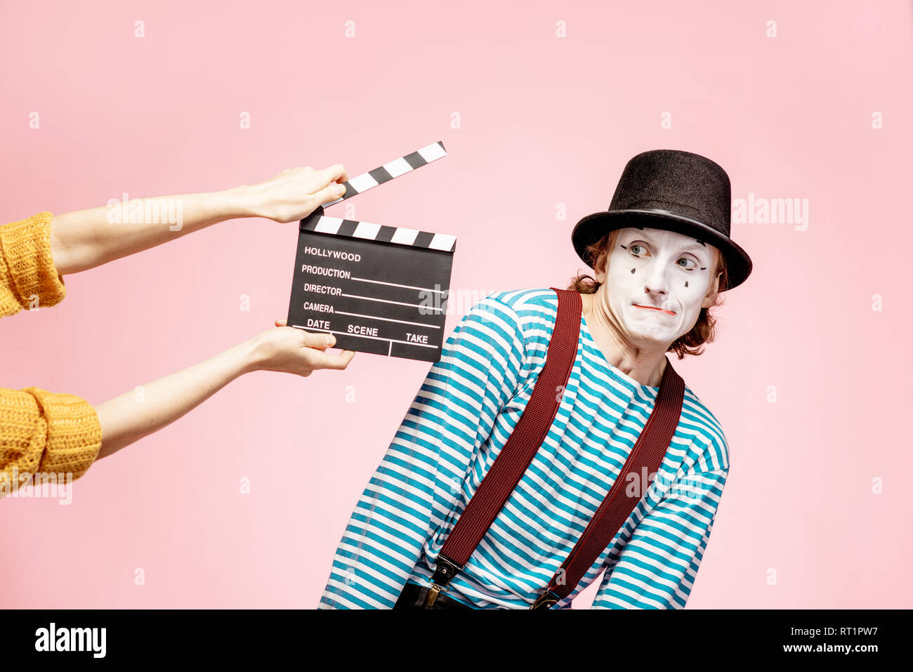 Portrait of an actor as a pantomime with cinematography clapperboard on ...