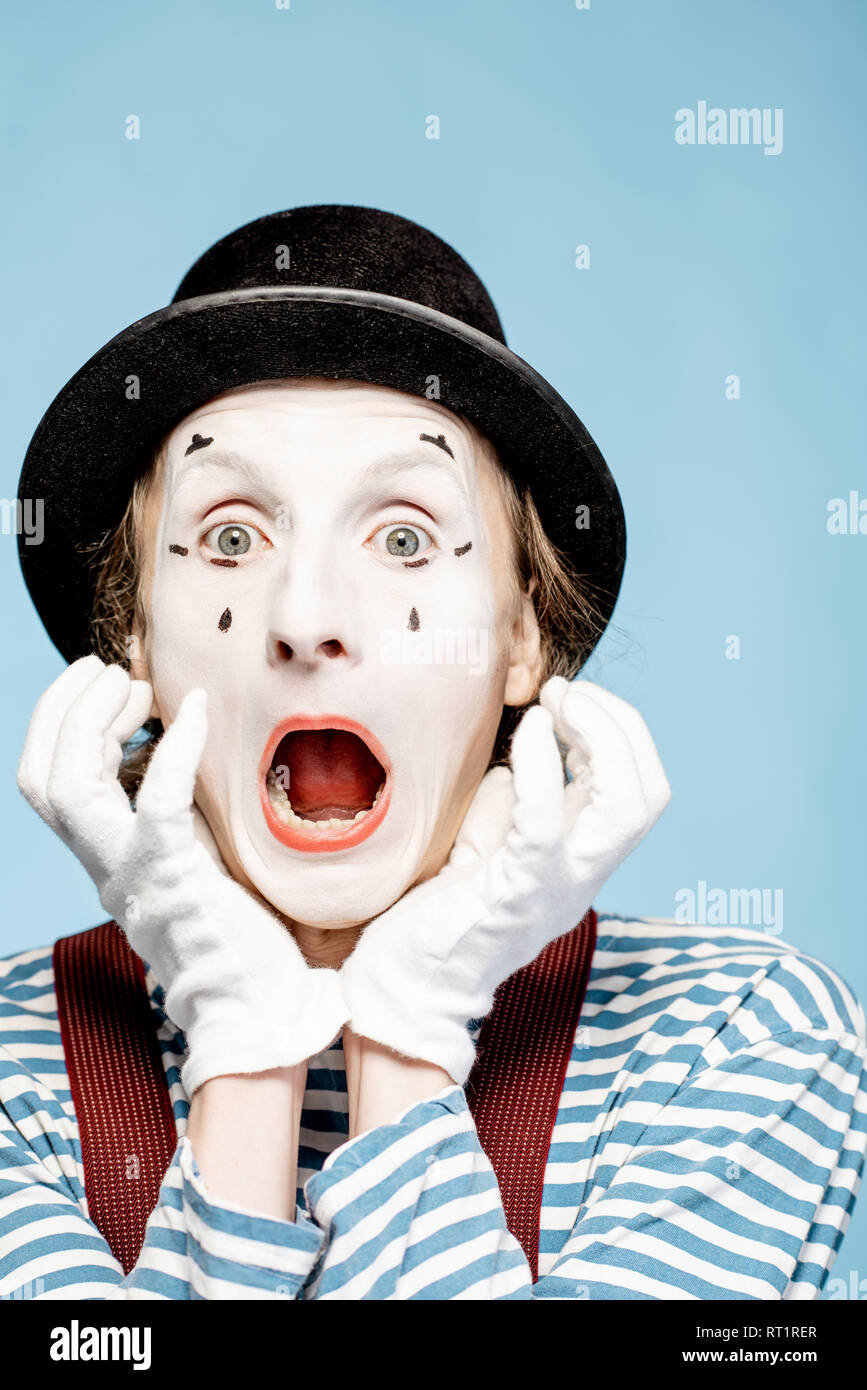 Close-up portrait of an actor as a pantomime with white facial makeup ...