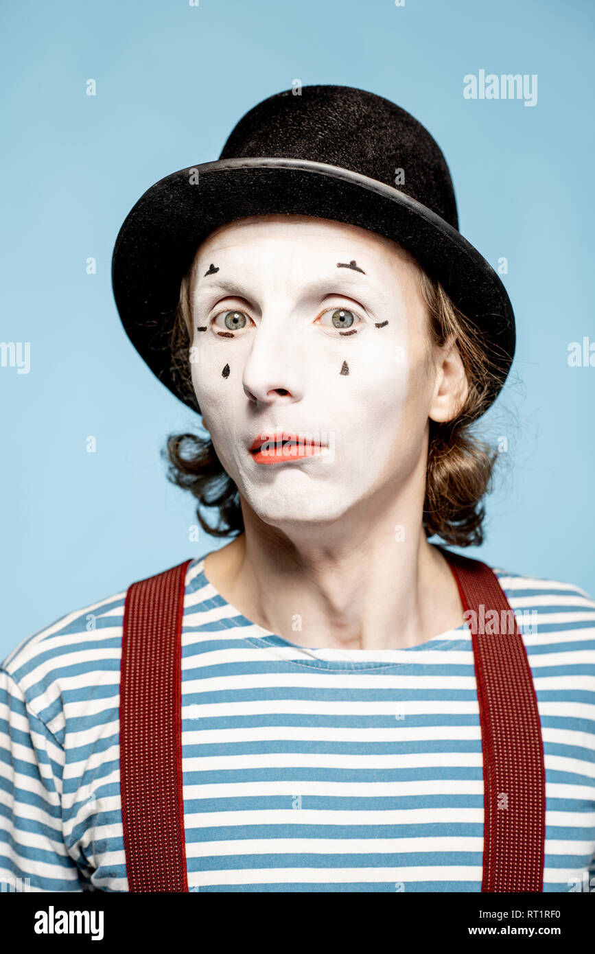 Close-up portrait of an actor as a pantomime with white facial makeup ...