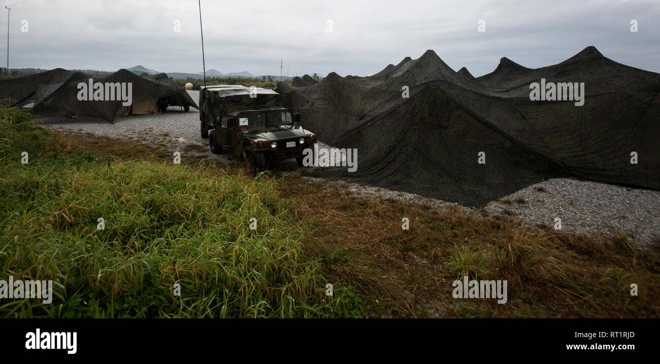 U.S. Marines with Headquarters Battalion, 3rd Marine Division, conduct ...