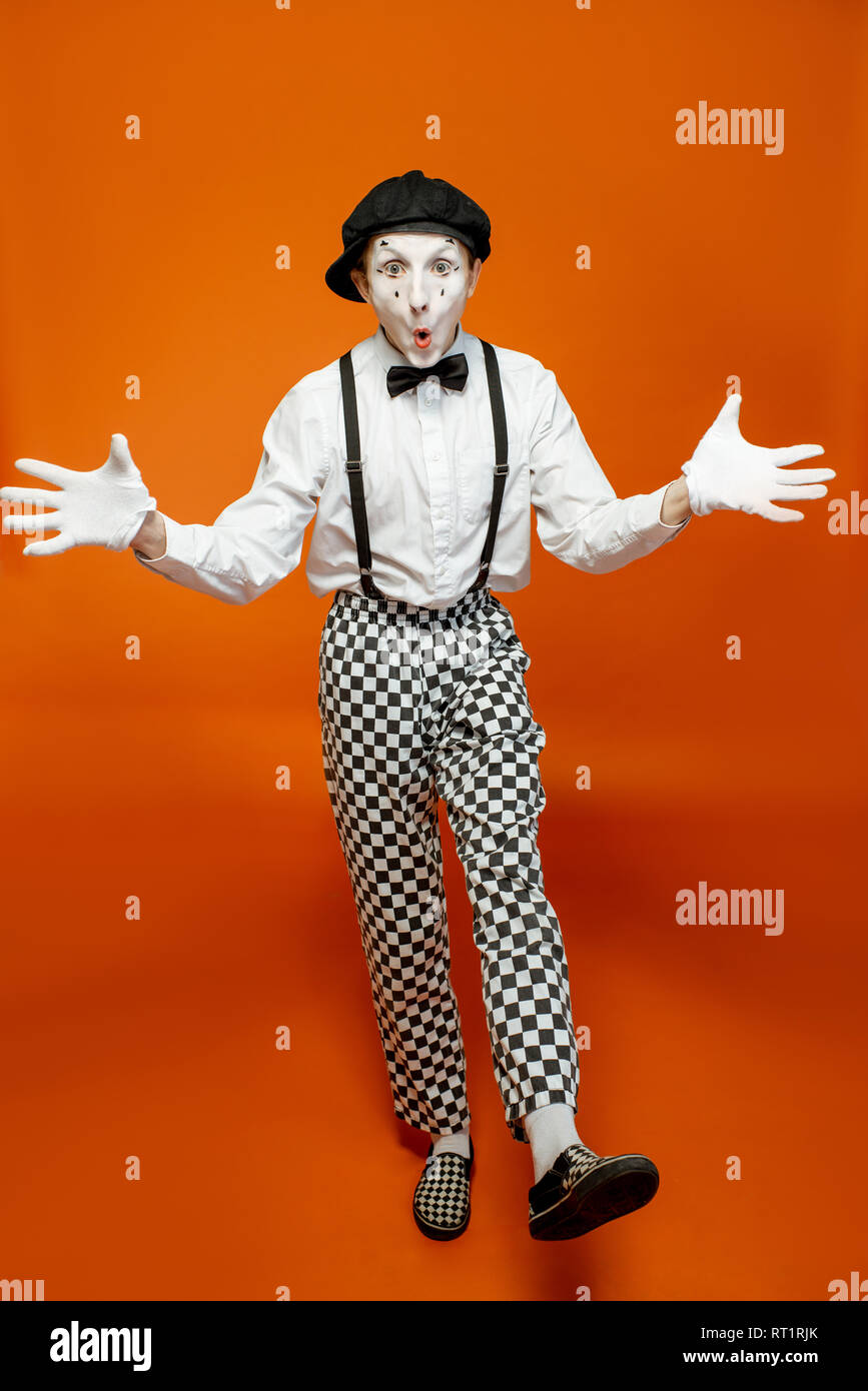 Full length portrait of an actor as a pantomime with white facial ...