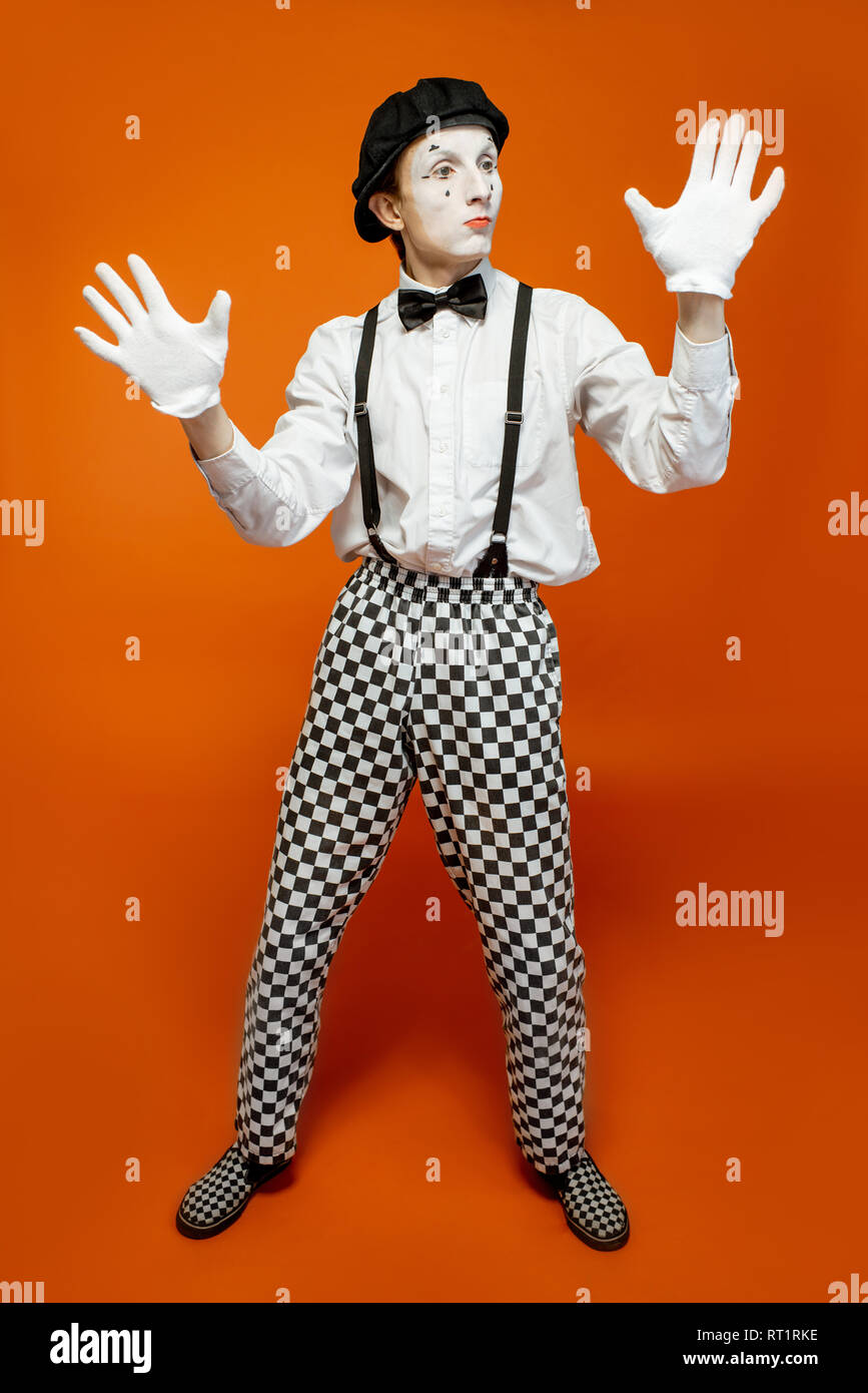 Full length portrait of an actor as a pantomime with white facial ...