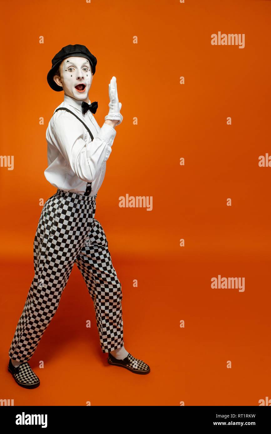Full length portrait of an actor as a pantomime with white facial ...