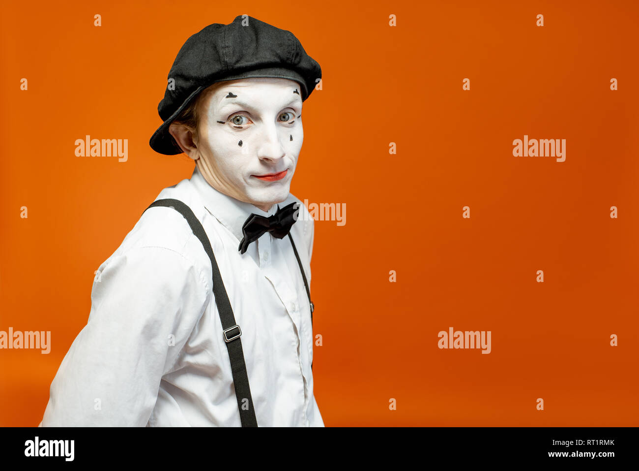 Portrait of an actor as a pantomime with white facial makeup showing ...