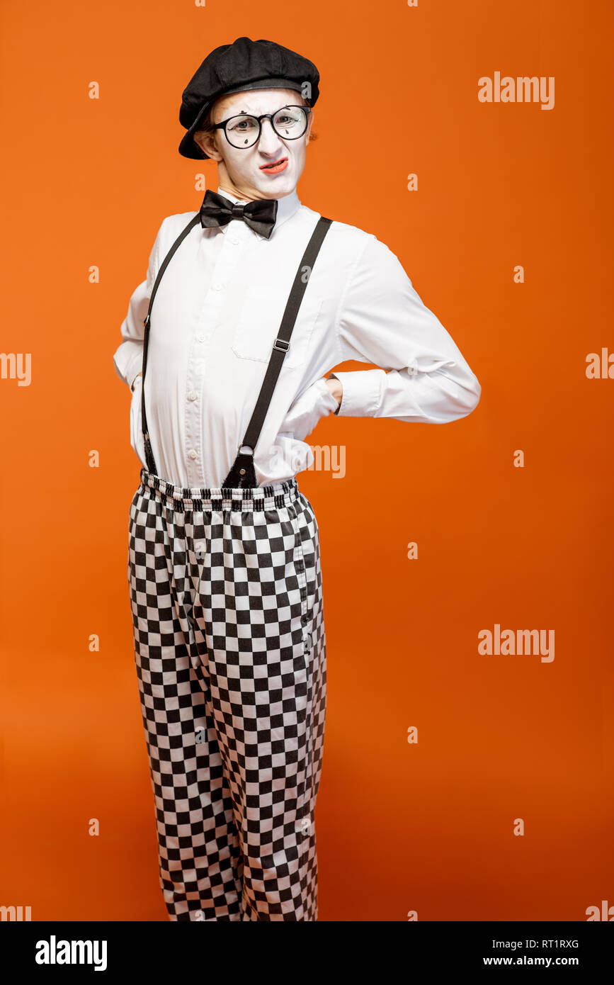 Portrait of an actor as a pantomime with white facial makeup showing ...