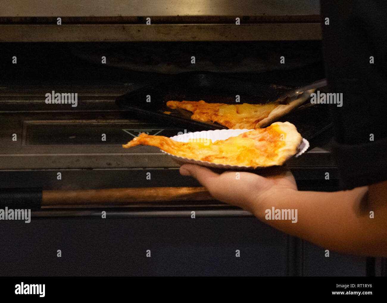 chef prepares delicious pizzas on the kitchen, view from the inside of ...