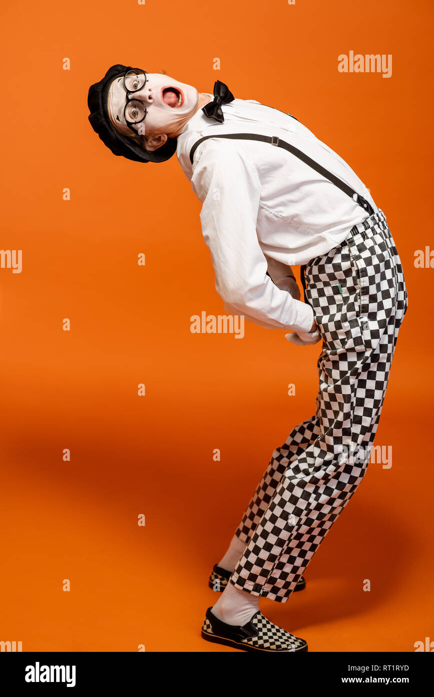Portrait of an actor as a pantomime with white facial makeup showing ...