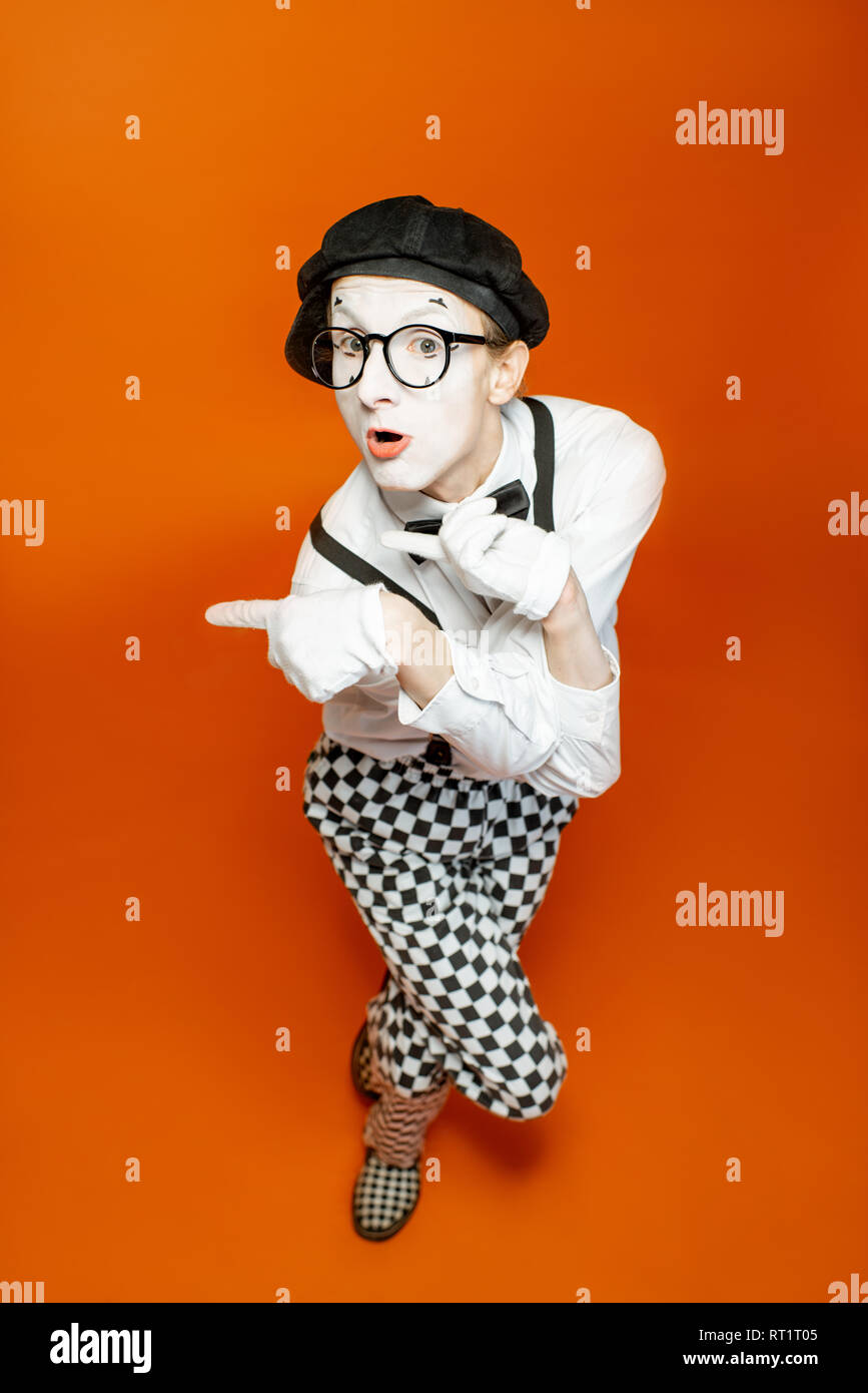 Portrait of an actor as a pantomime with white facial makeup showing ...