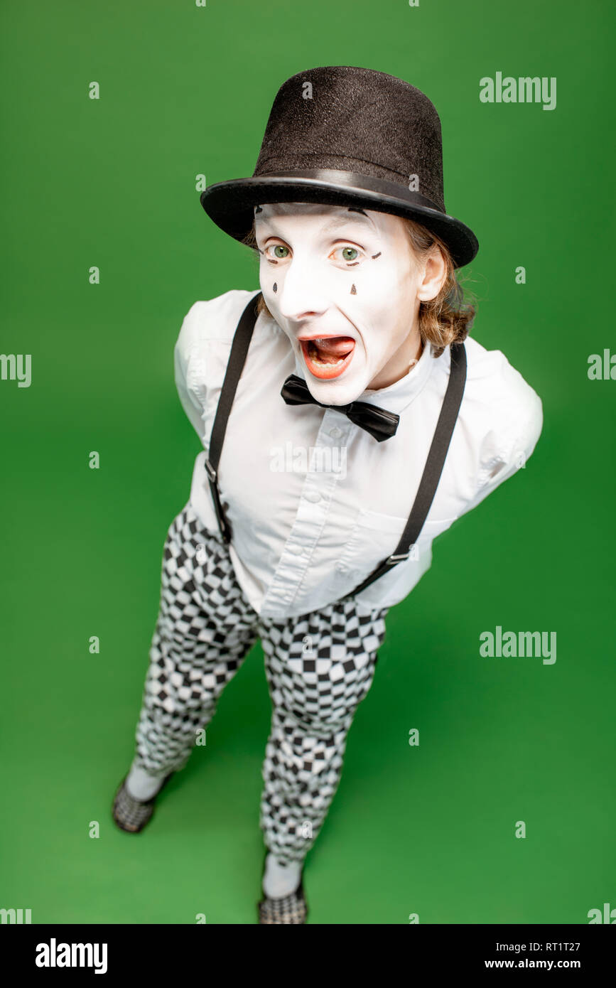 Full body portrait of an actor as a pantomime posing with expressive ...
