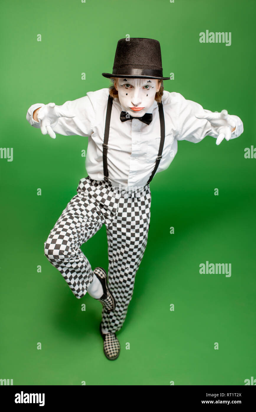 Full body portrait of an actor as a pantomime posing with expressive ...