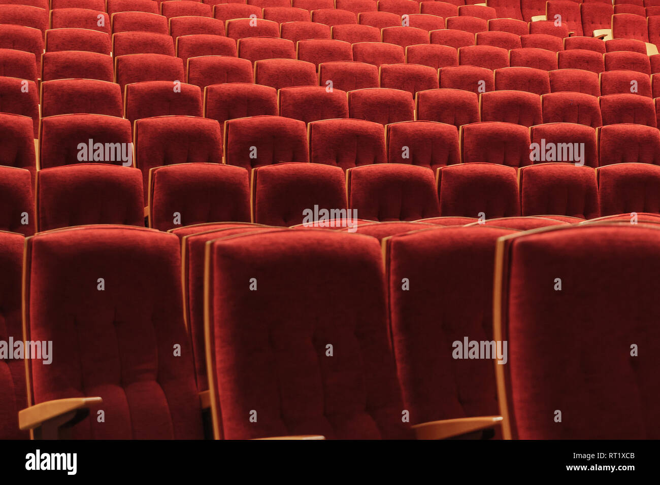 Red chairs in the auditorium at the concert Stock Photo - Alamy