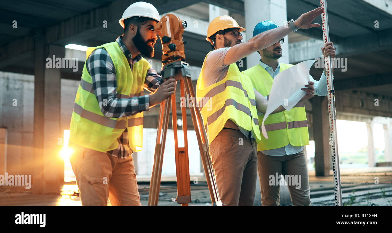 Portrait of construction engineers working on building site Stock Photo ...