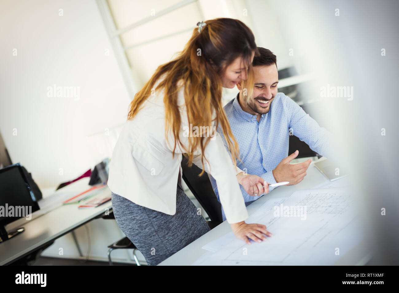 Successful company with happy workers Stock Photo - Alamy