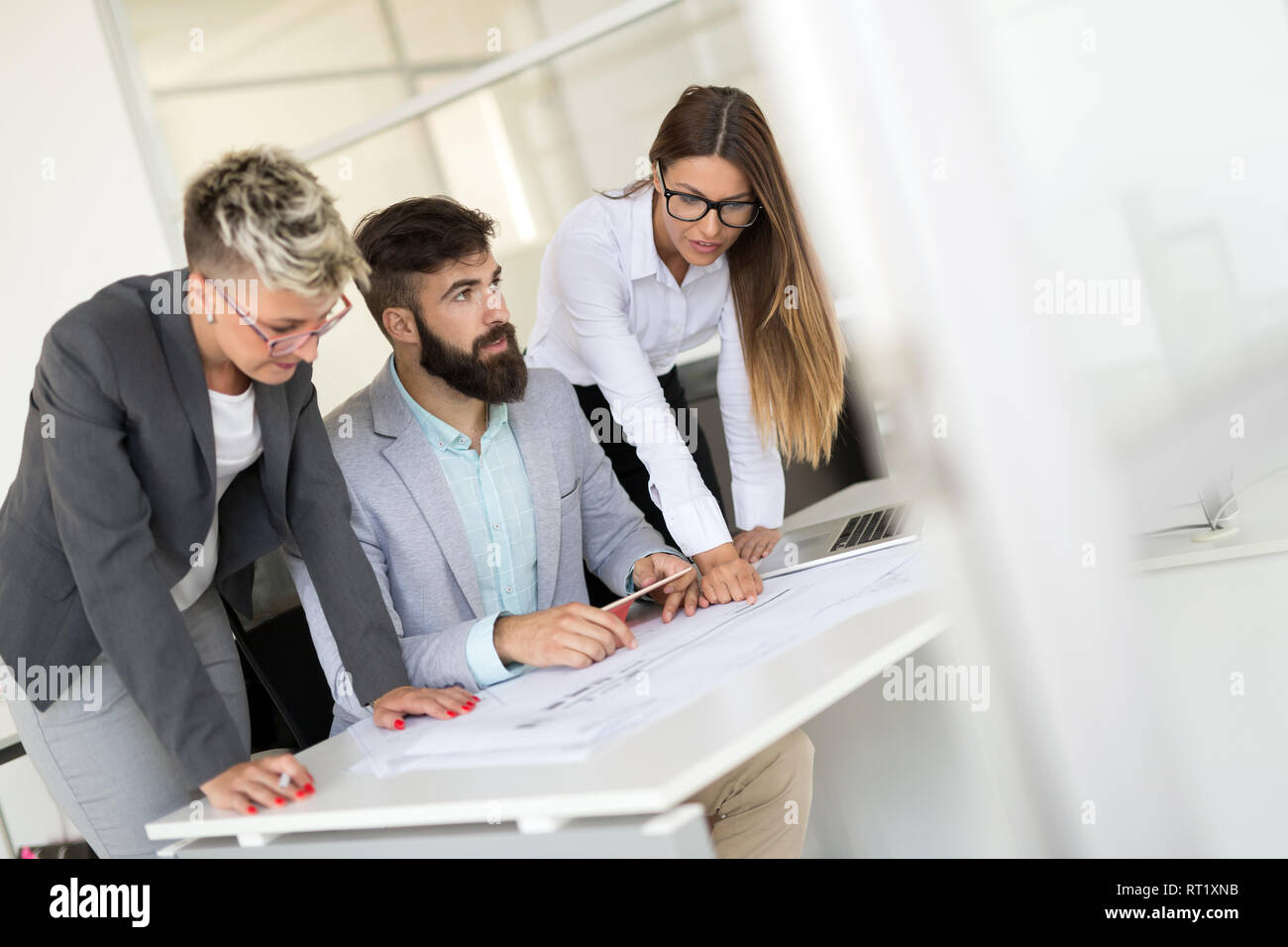 Group of business people collaborating in office Stock Photo - Alamy