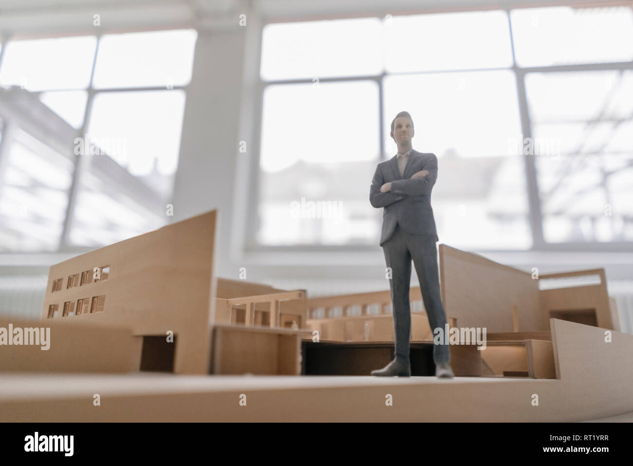Miniature businessman figurine standing in architectural model Stock ...
