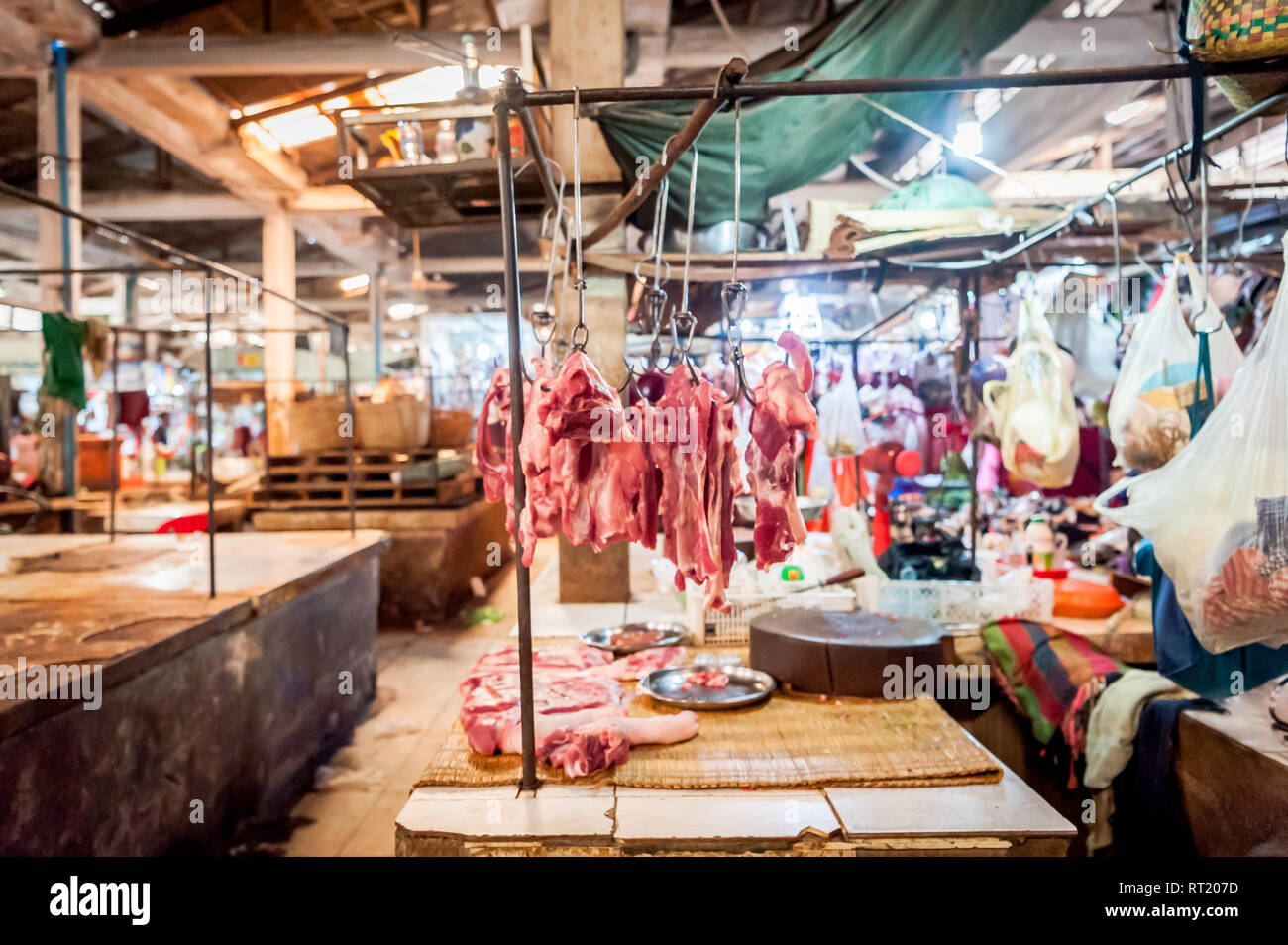 Scenes inside a very cramped, cheap market in Phnom Penh Cambodia. Its ...