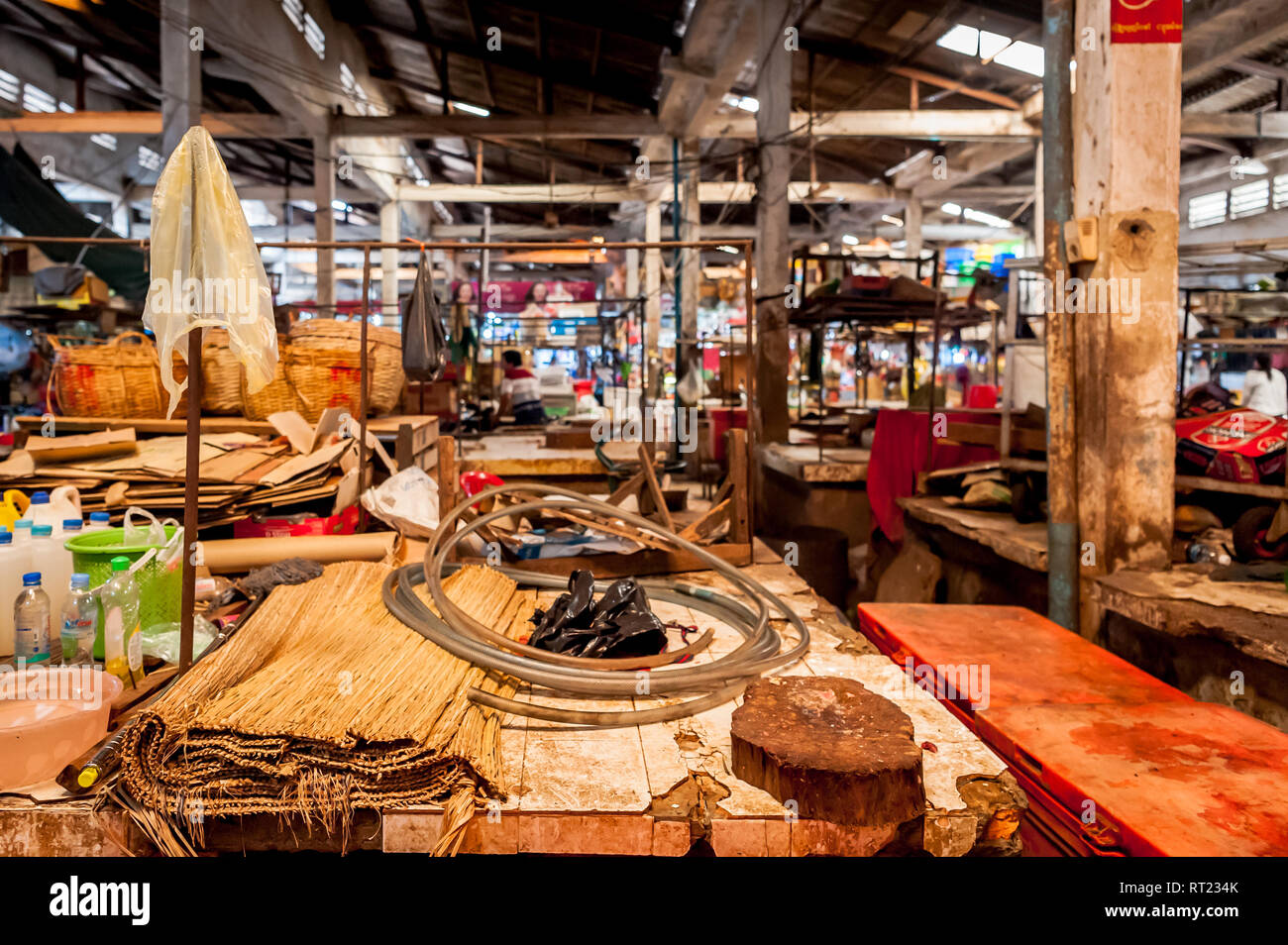 Scenes inside a very cramped, cheap market in Phnom Penh Cambodia. Its clearly very dirty and ...