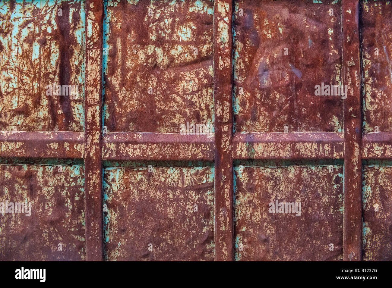 Large rusted metal gate of train wagon in red, orange-green Stock Photo ...