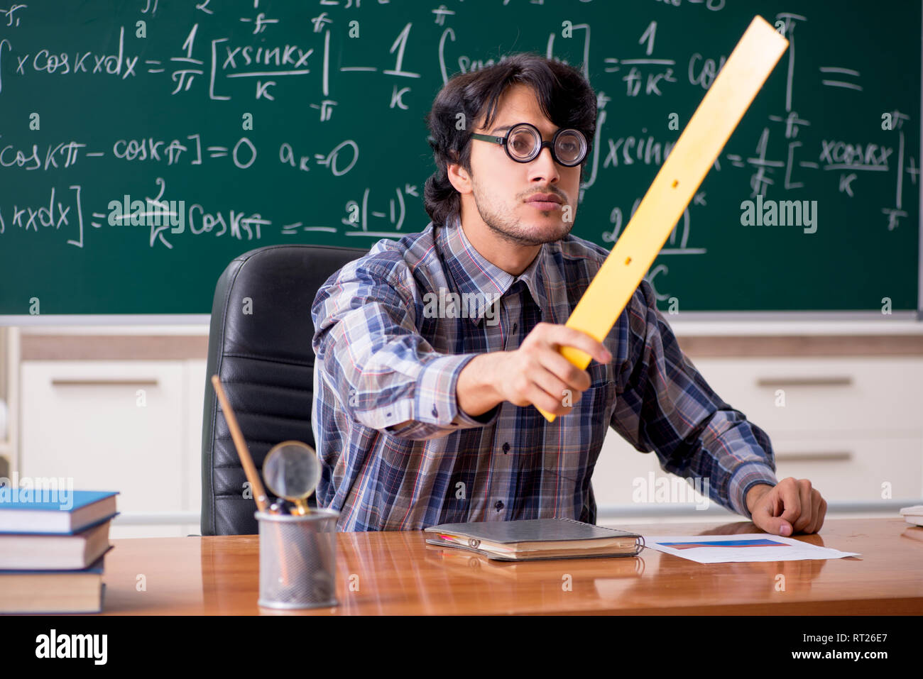 Angry teacher and ruler hi-res stock photography and images - Alamy
