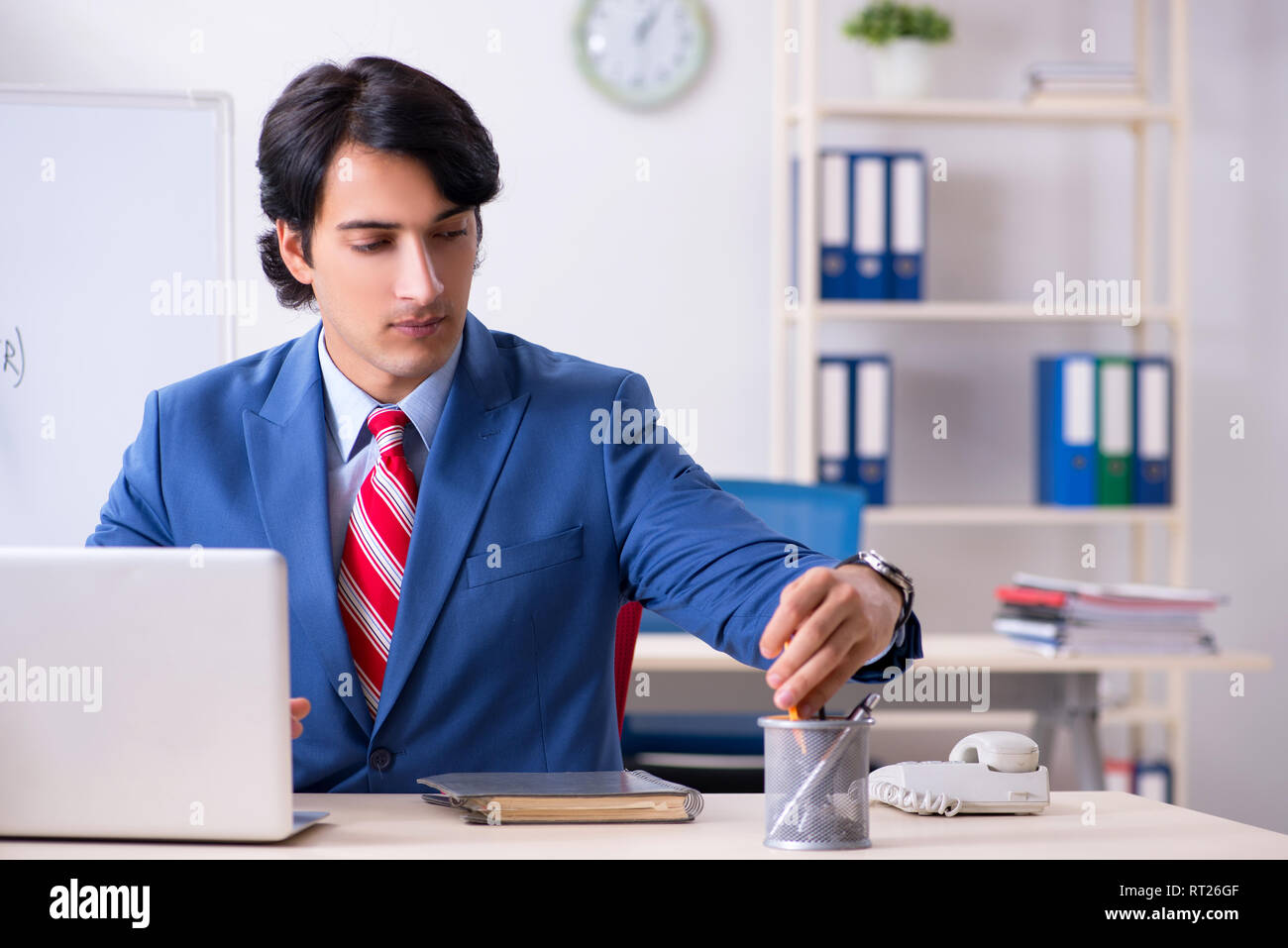 Busy businessman explaining business charts Stock Photo - Alamy