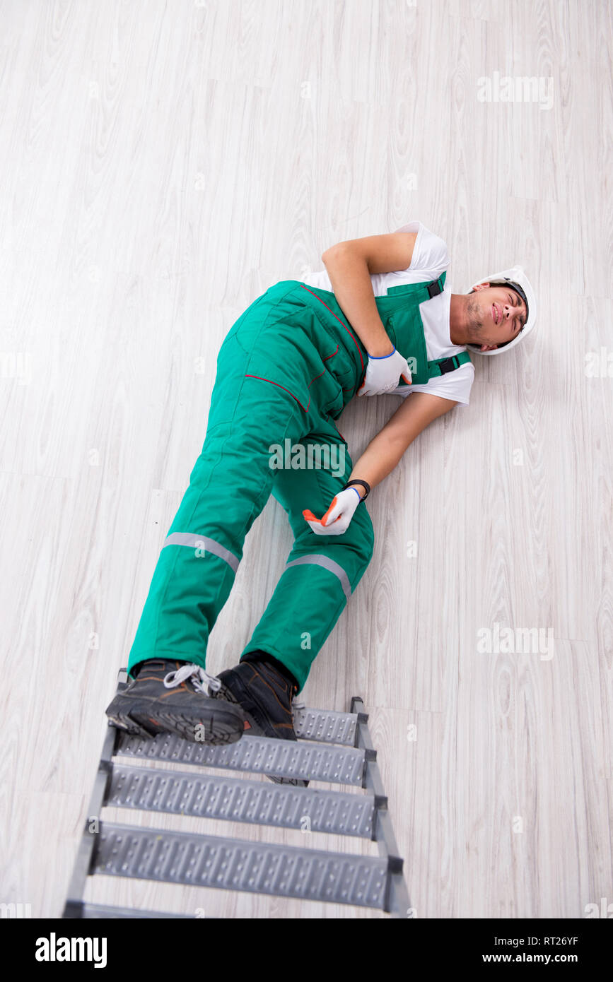 Young worker falling from the ladder Stock Photo - Alamy