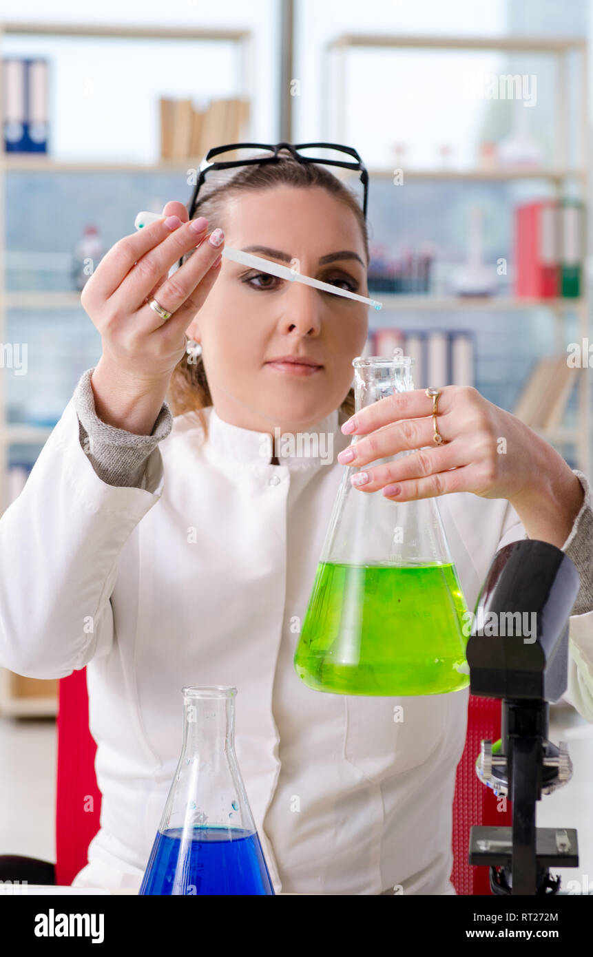 Female scientist analyzing liquid extract hi-res stock photography and ...