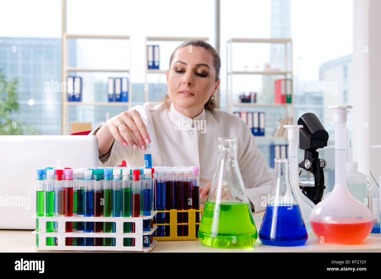 Female chemist working in medical lab Stock Photo - Alamy