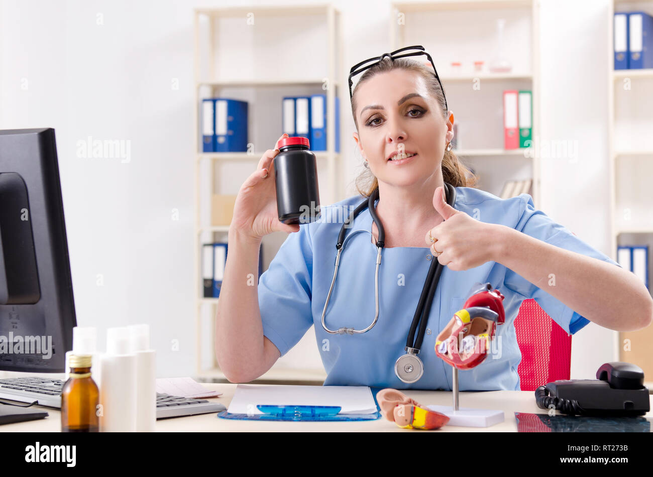Female doctor cardiologist working in the clinic Stock Photo - Alamy