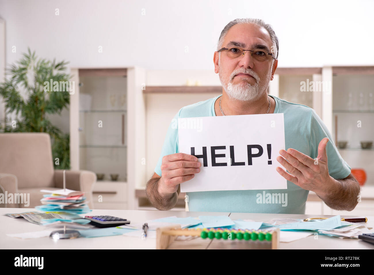 White bearded old man in budget planning concept Stock Photo - Alamy