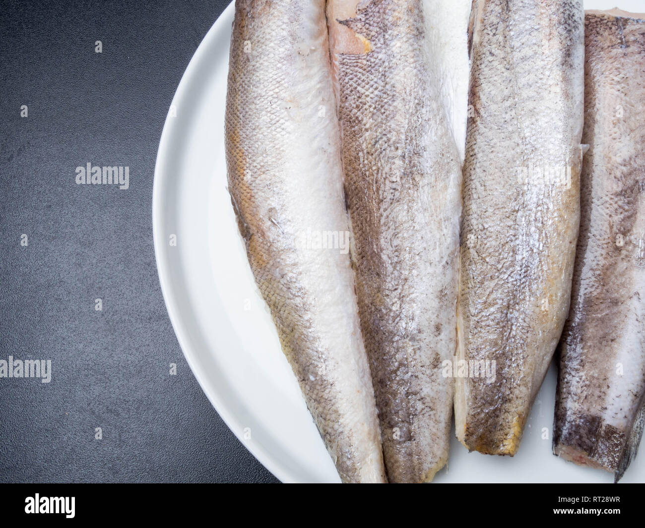 raw fish hake, healthy white fish concept Stock Photo - Alamy