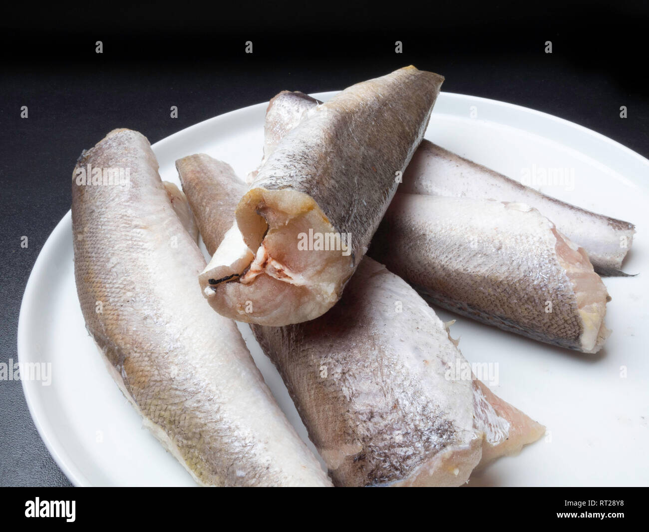 raw fish hake, healthy white fish concept Stock Photo - Alamy