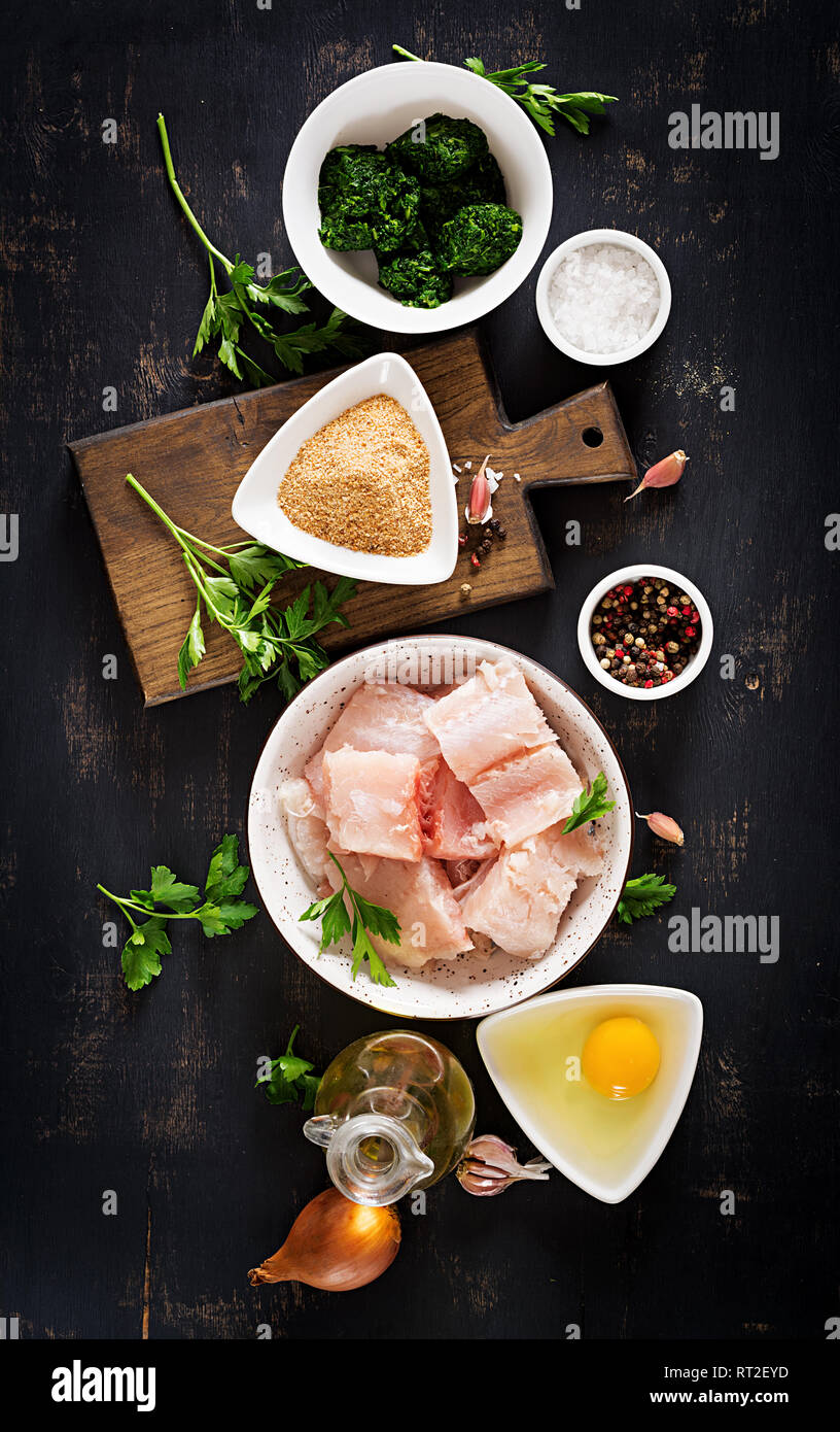 Ingredients for homemade Fish Cake cod, spinach, egg and breadcrumbs ...