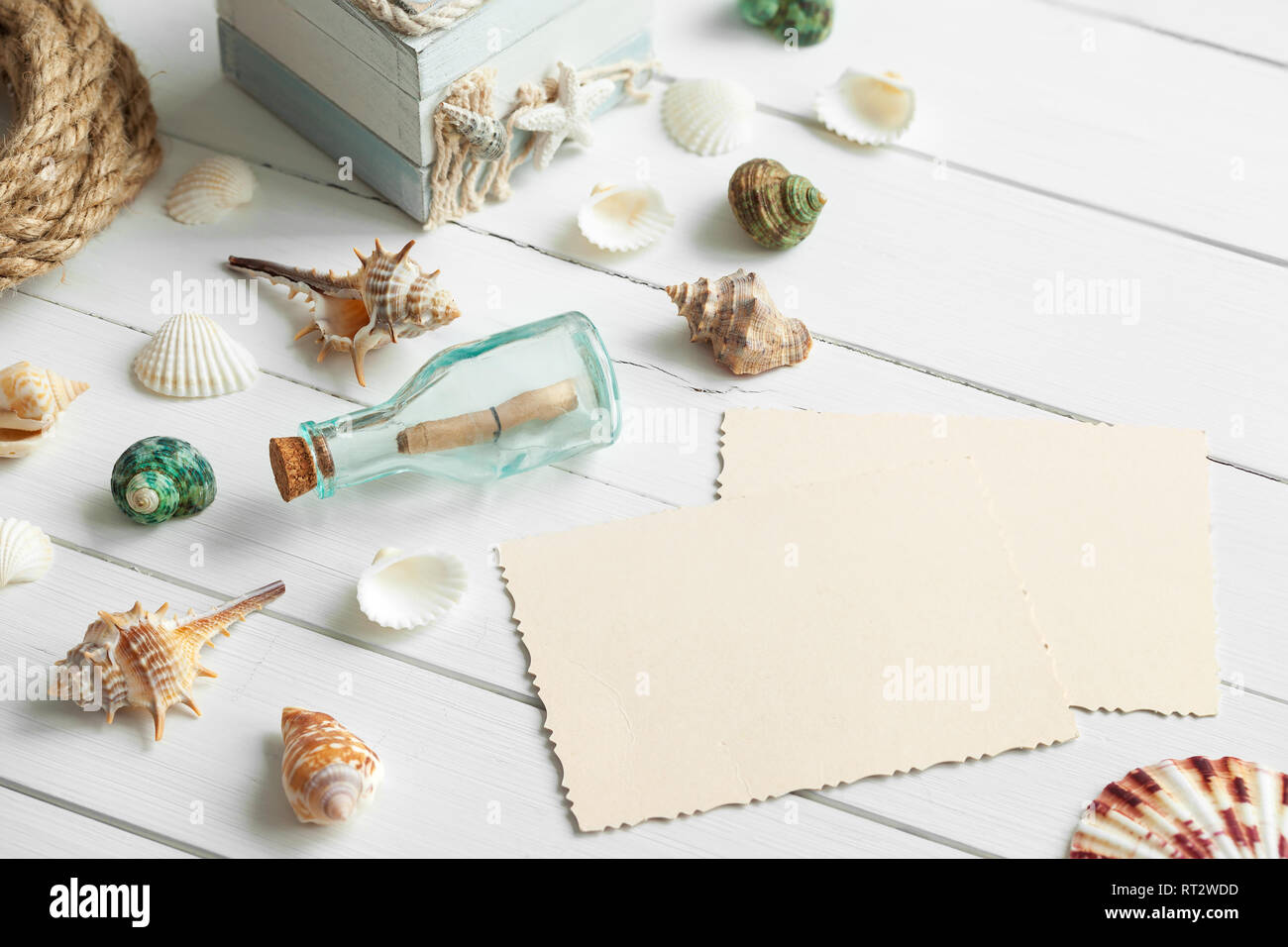 Nautical life style items: bottle with message, sea shells, chest and ...