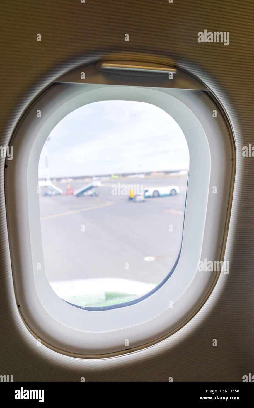 The window of the airplane. A view of porthole window on board an ...