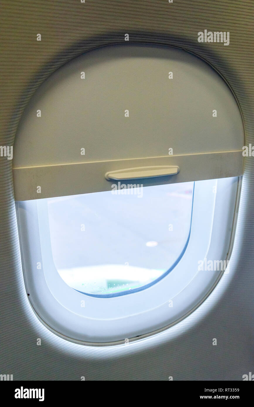 The window of the airplane. A view of porthole window on board an ...
