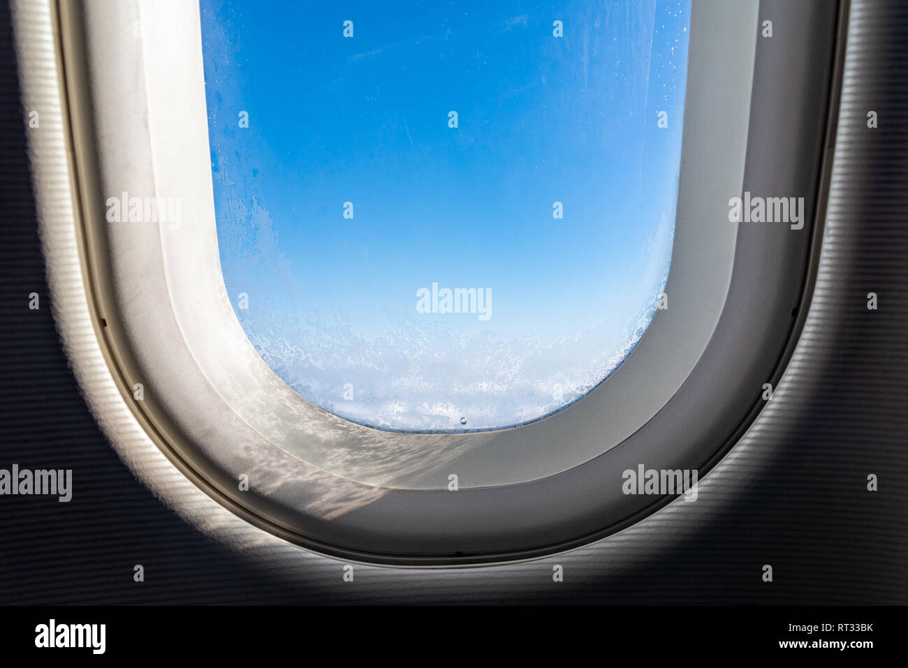 The window of the airplane. A view of porthole window on board an ...
