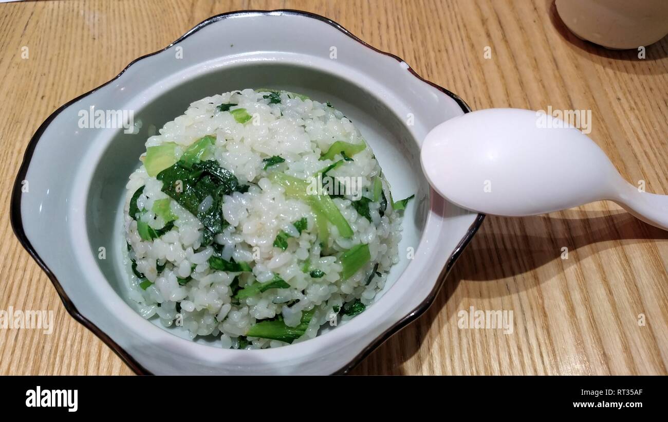 The Healthy eating greens and traditional fire rice Stock Photo - Alamy
