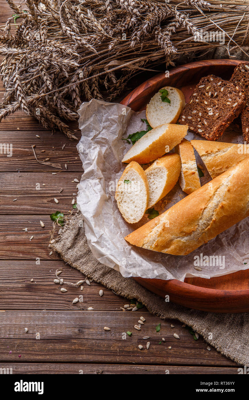 Table with plate of bread Stock Photo - Alamy