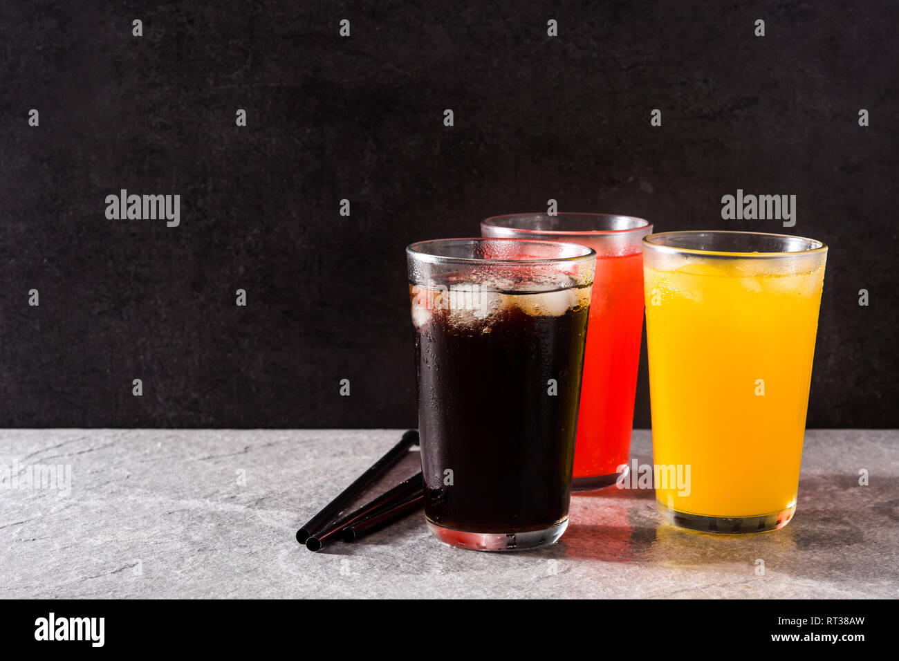 Colorful soft drinks for summer on gray background. Copyspace Stock ...