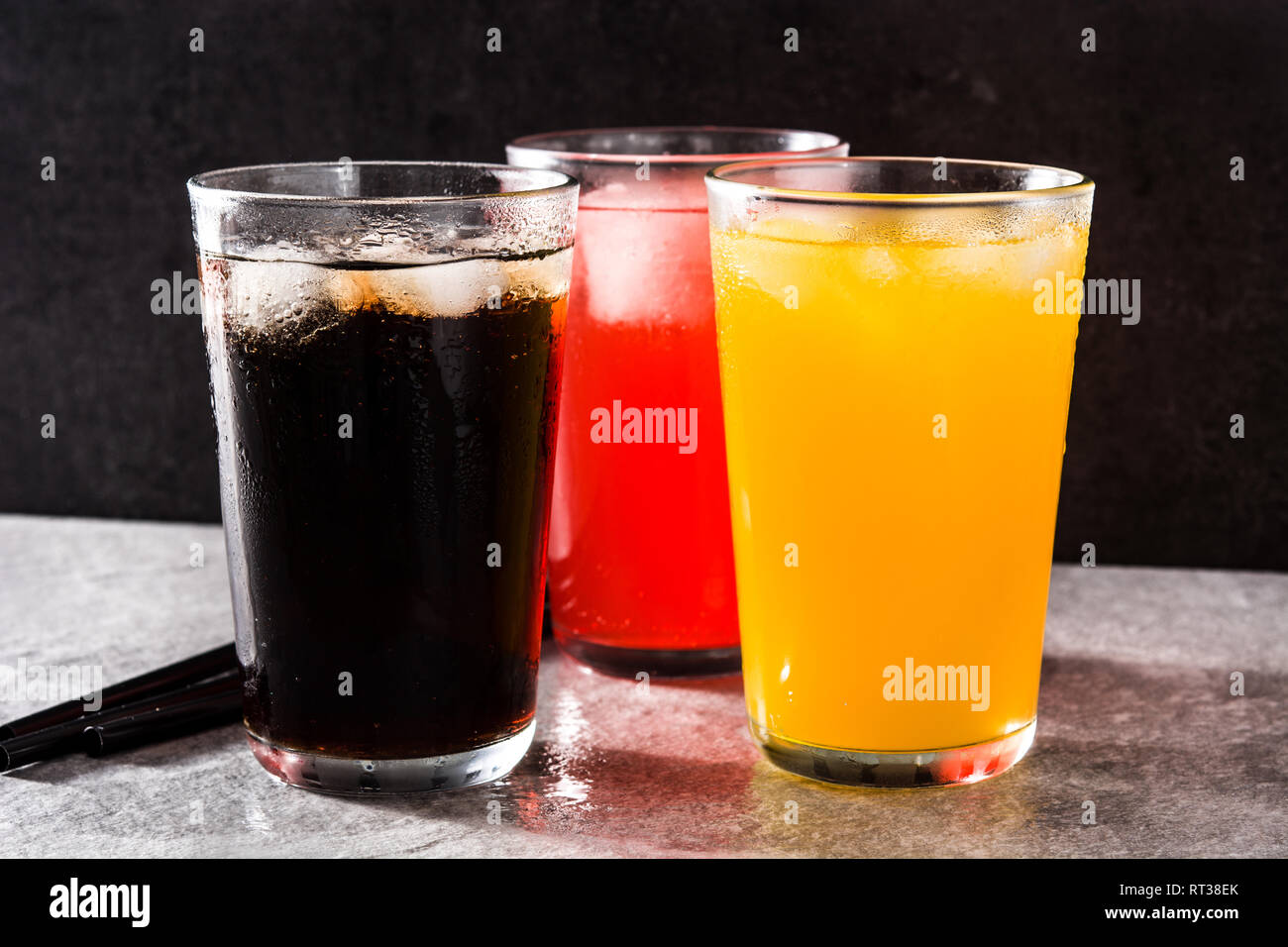 Colorful soft drinks for summer on gray background Stock Photo - Alamy