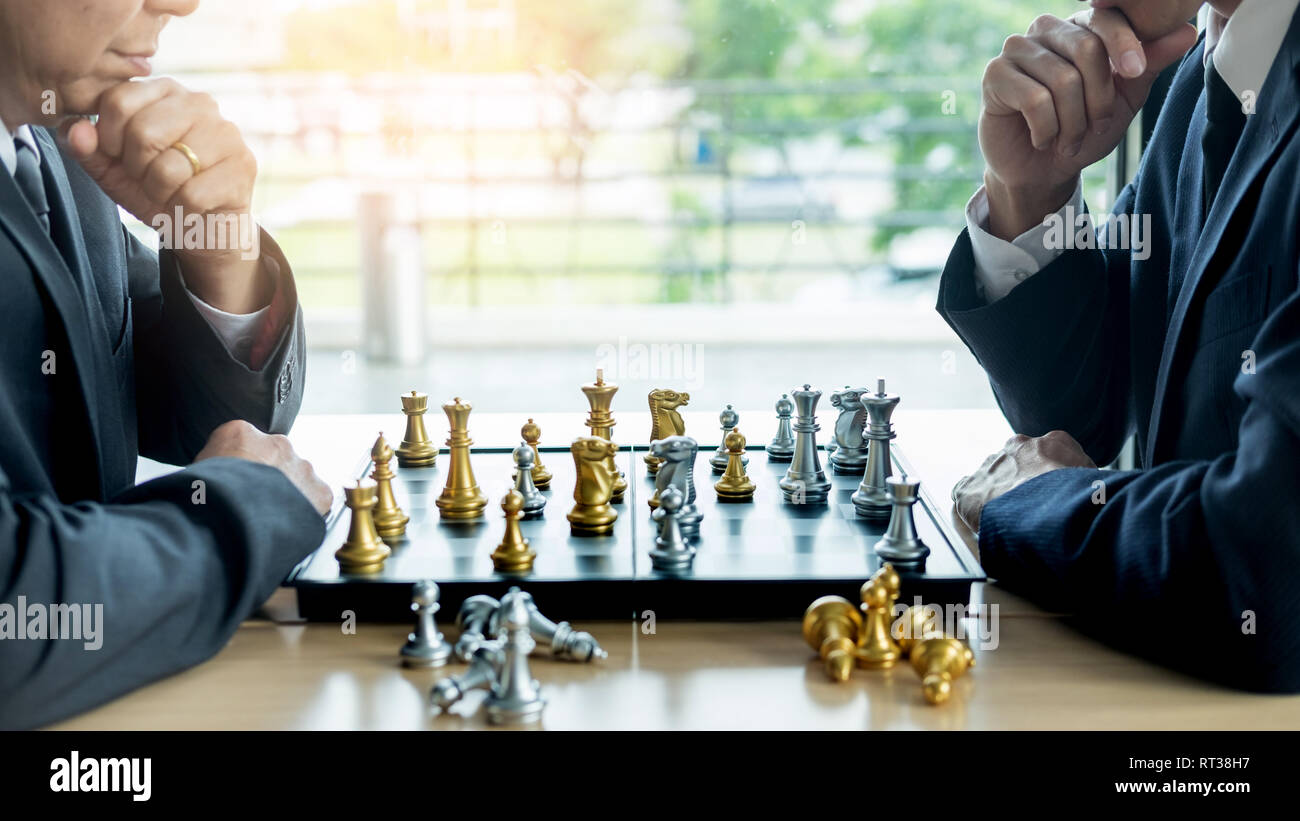 businessman playing chess game figures on wooden table for analysis new ...
