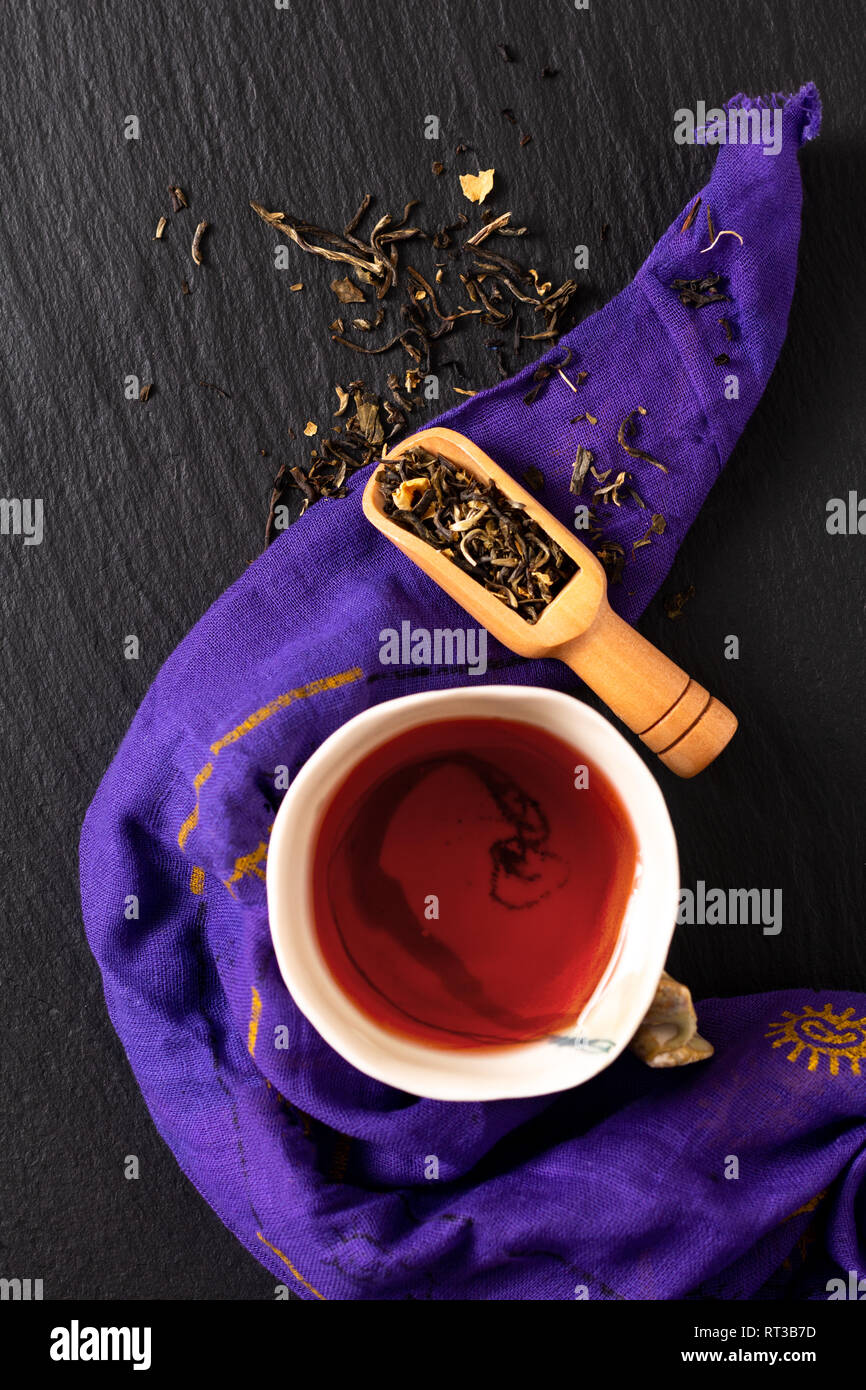 Drink concept top view of Organic Herbal tea with tea cup on black ...