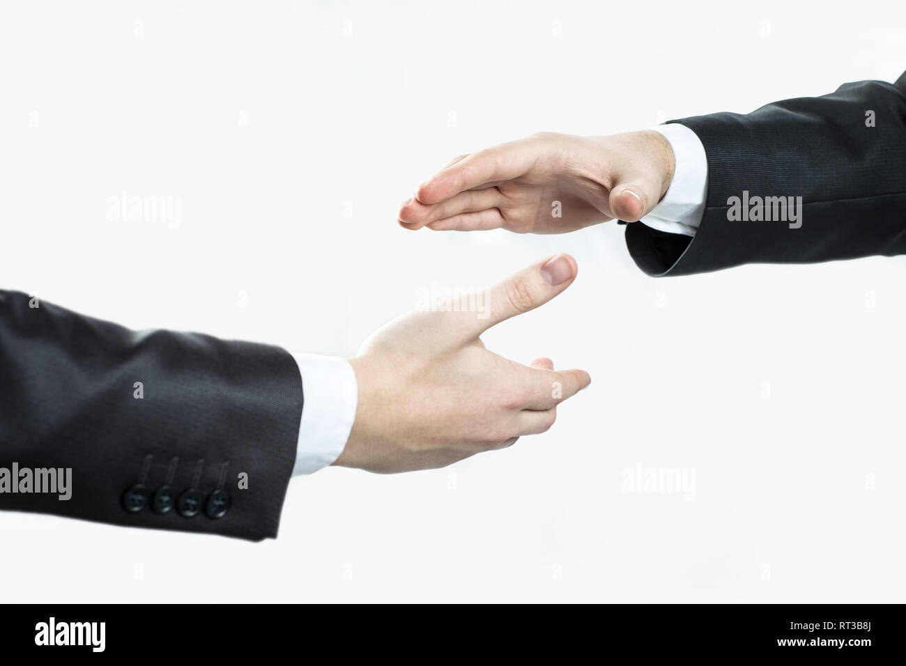 close up.two businessmen holding out their hands for a handshake Stock ...