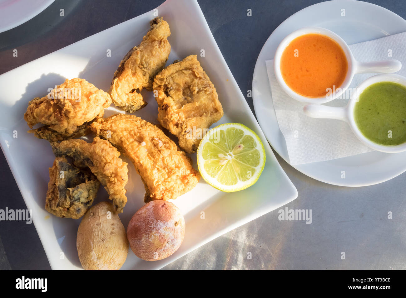 Fried moray eel with salt potato, accompanied by mojo picon and green ...