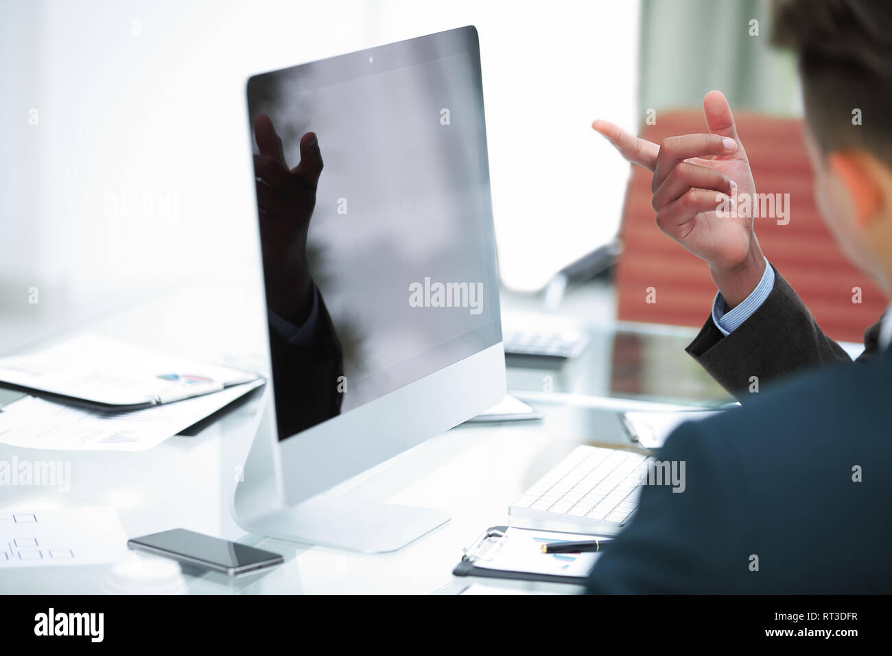 closeup.young businessman showing on computer monitor. people and ...