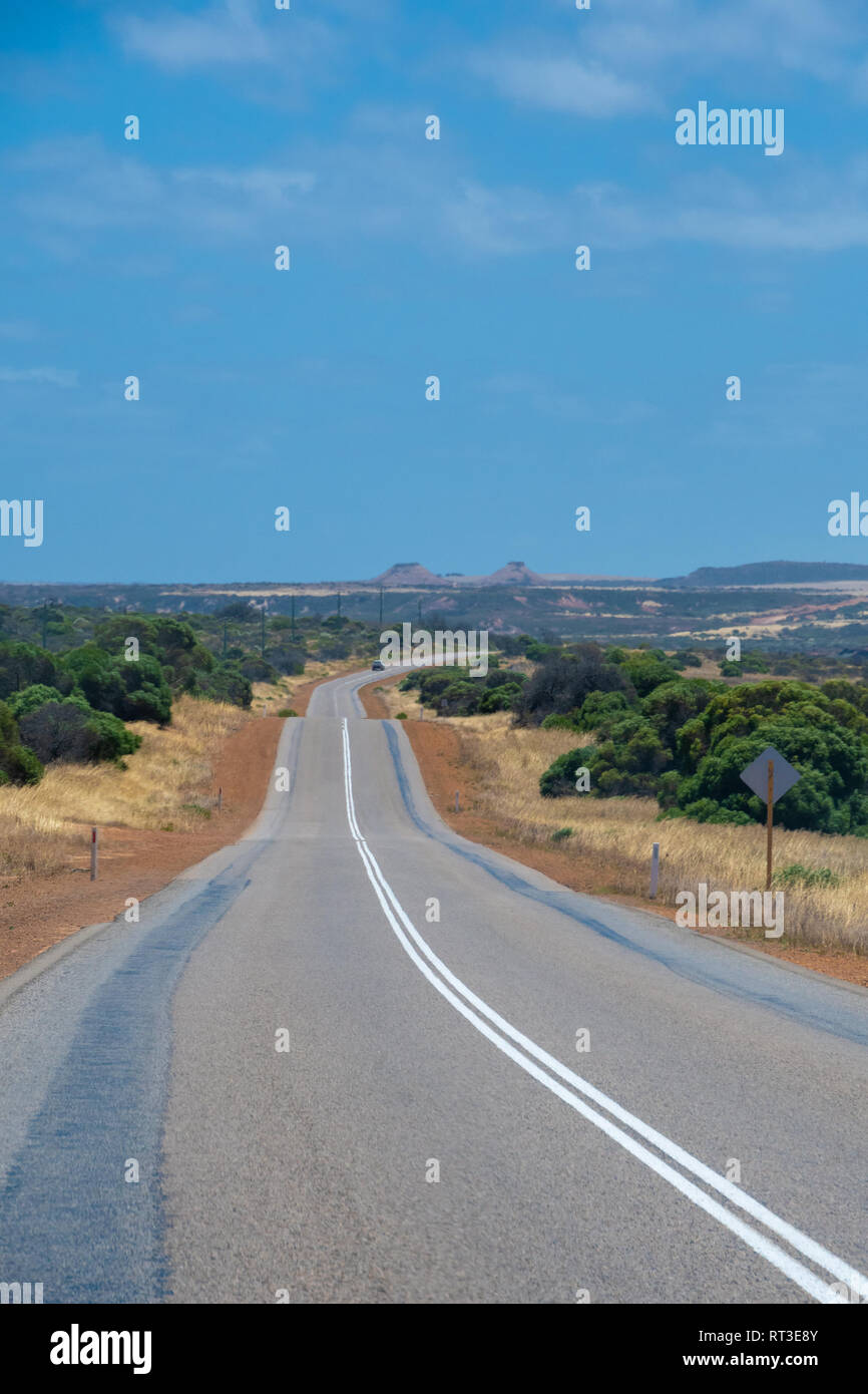 Road leading through australian bush landscape during hot spring Stock ...