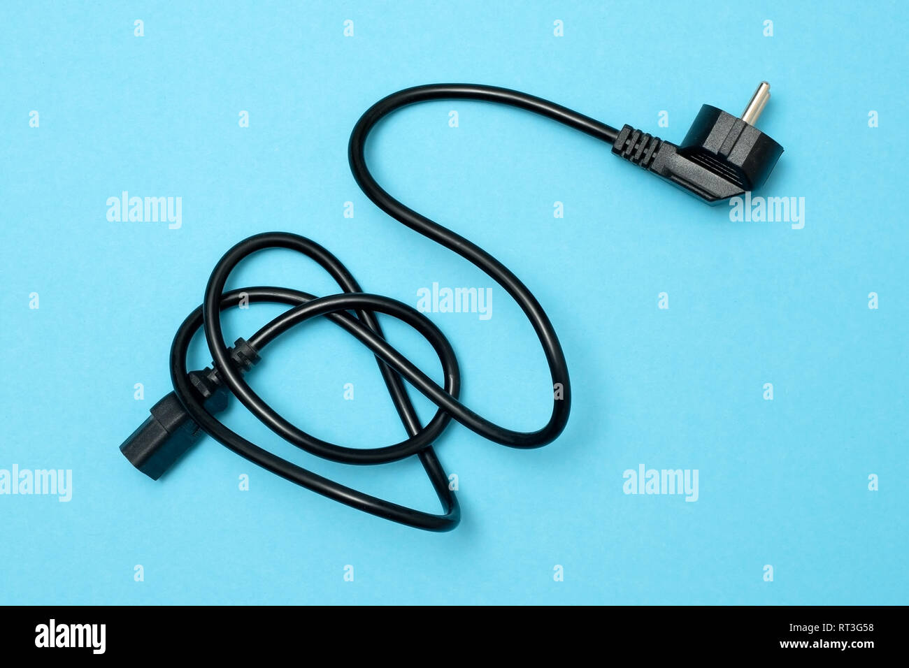 Black power cable line for computer on blue background. Top view Stock ...